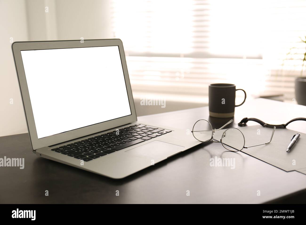 Modern laptop on office table. Stylish workplace Stock Photo - Alamy