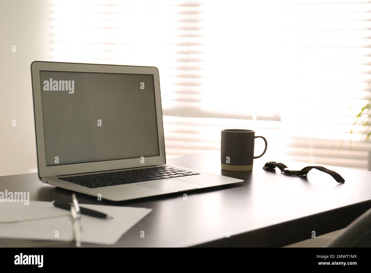 Modern laptop on office table. Stylish workplace Stock Photo - Alamy