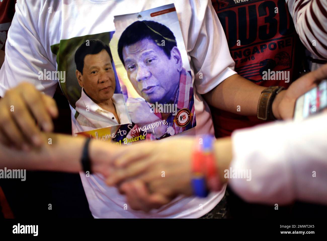 A Filipino supporter wears a t-shirt with pictures of Philippine ...