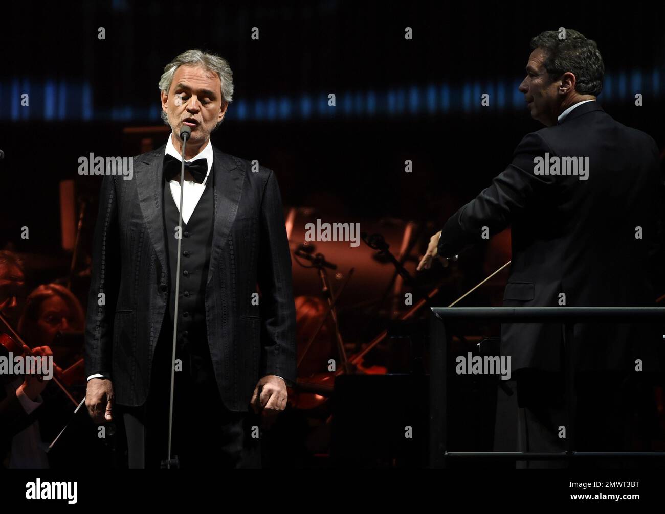 Singer Andrea Bocelli, left, performs with conductor Eugene Kohn and ...
