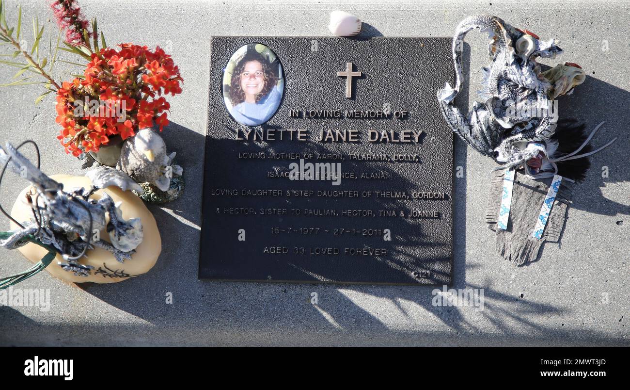 In this Aug. 16, 2016 photo, flowers and mementos adorn the grave of ...