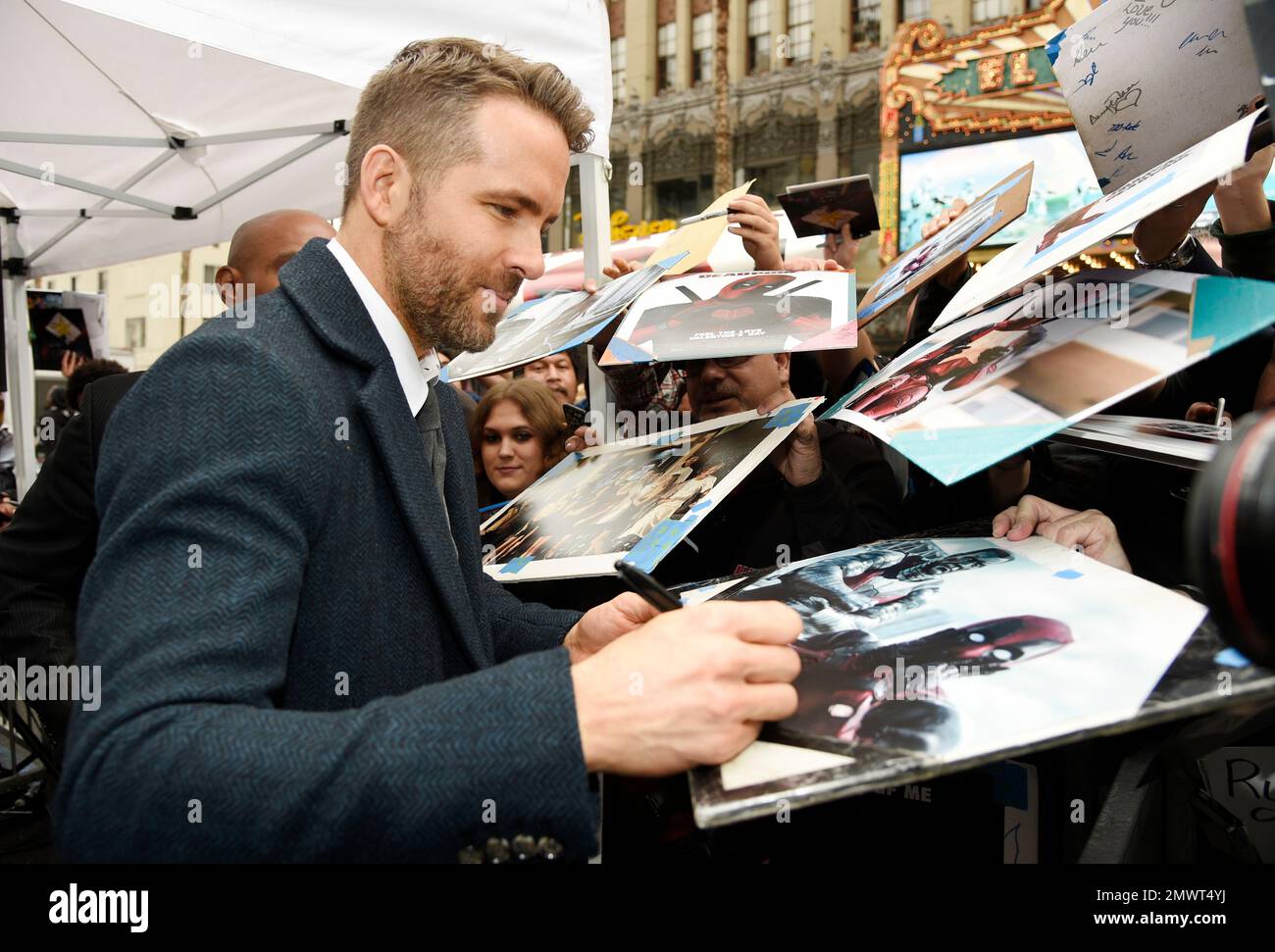 Actor Ryan Reynolds signs autographs following a ceremony to award him ...