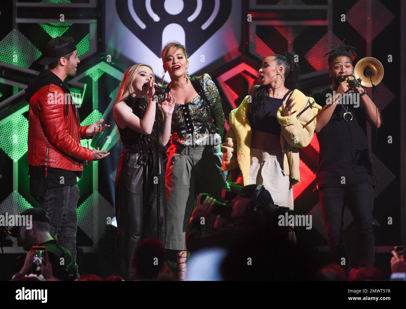 Sabrina Carpenter, left, Rita Ora and Tinashe perform together at Z100 ...