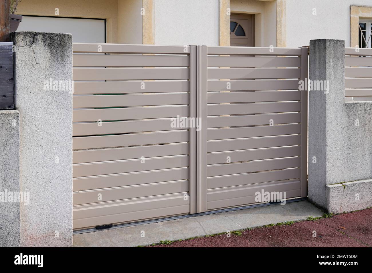 portal beige metal aluminum house gate street view Stock Photo - Alamy