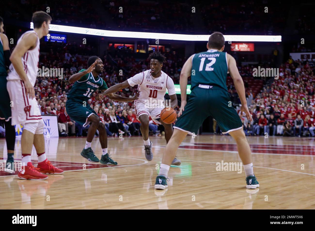 Wisconsin's Nigel Hayes (10) and Green Bay's Tevin Findlay (32) and ...