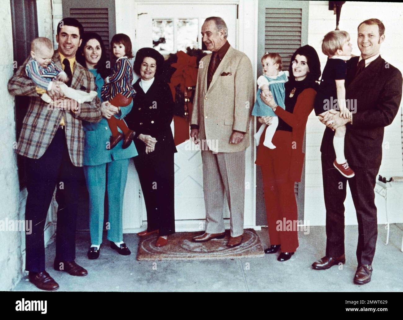 President Lyndon B. Johnson with his wife Lady Bird Johnson, surrounded by their daughters, sons ...