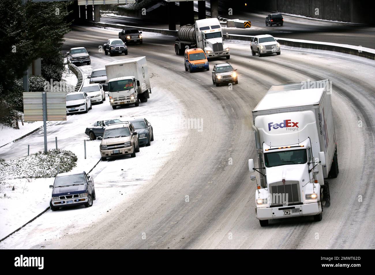 Abandoned cars line the side of I-405 as commuters work their way into ...