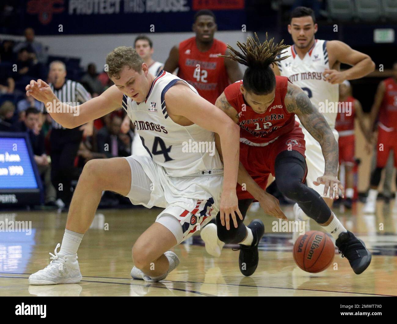 Saint Mary's Jock Landale, left, and Western Kentucky's Pancake Thomas ...