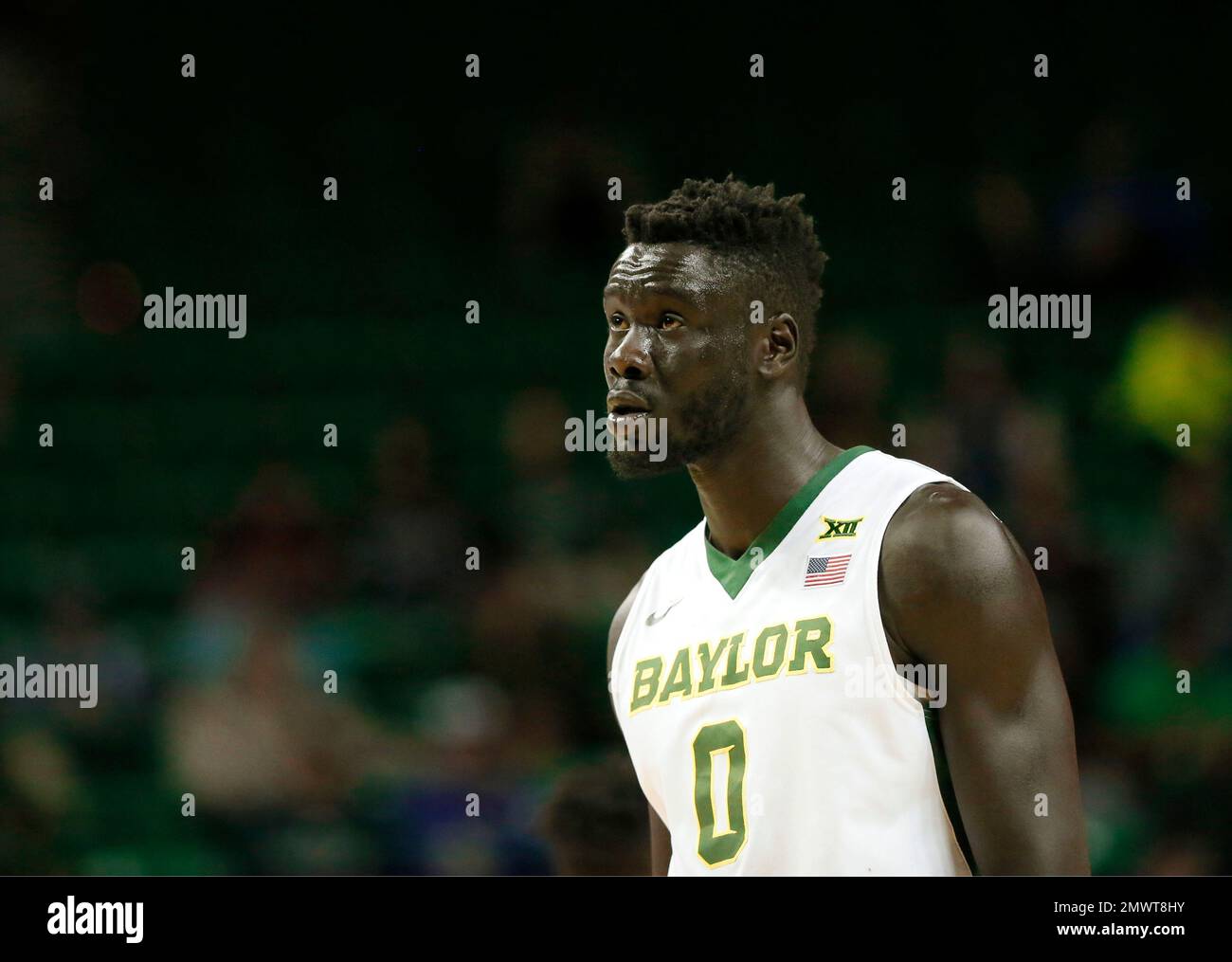 Baylor forward Jo Lual-Acuil Jr. (0) of Australia walks up court in the ...