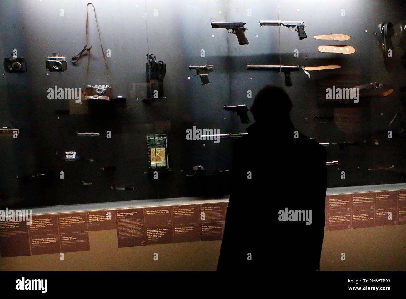 A Visitor Looks At Real Life Spy Gadgets And Weapons Of Secret Agents Around The World Displayed