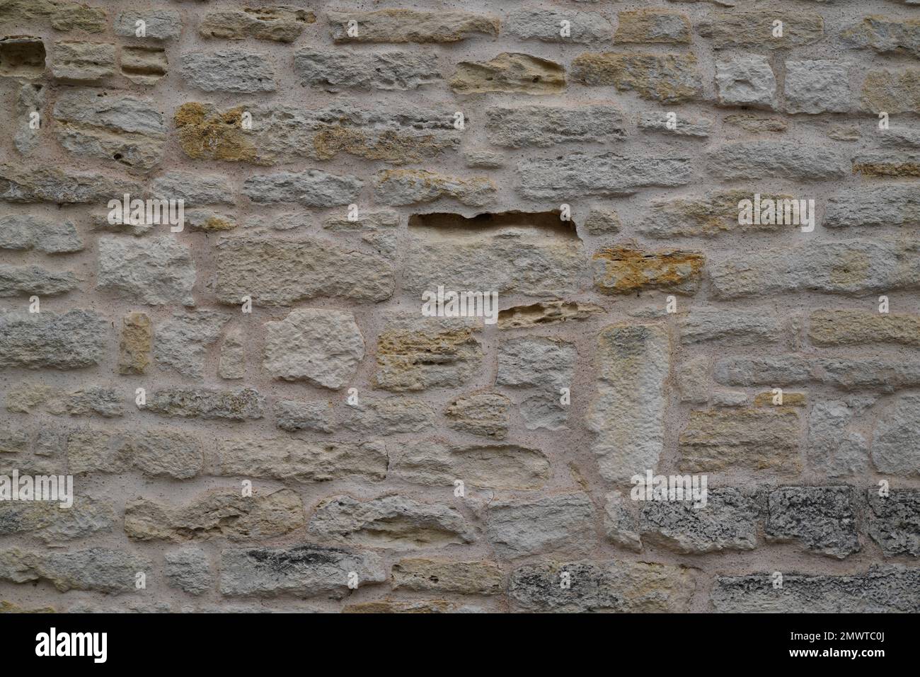 Old square stone grey brown wall of beige brick horizontal background ...