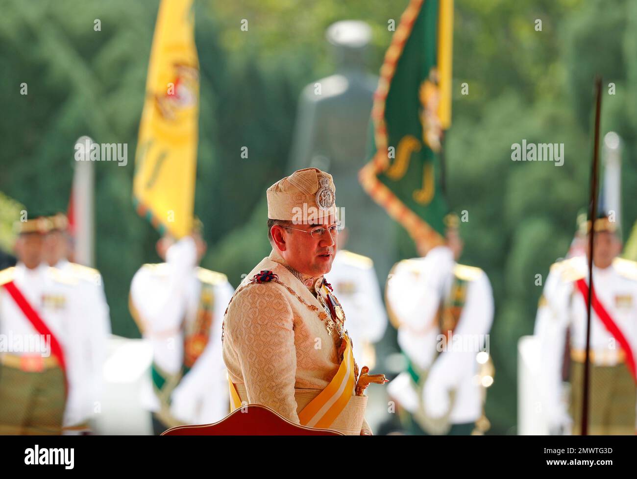 Sultan Muhammad V stands during his welcome ceremony at Parliament ...