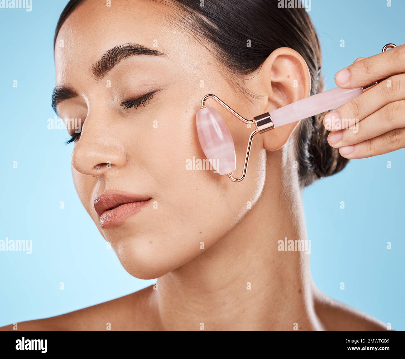 Skin care, face roller and beauty woman with facial massage for ...