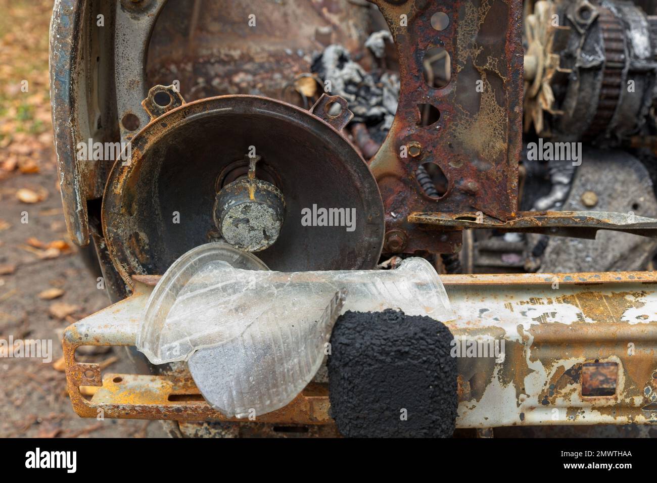 Head lamp of a burned out car Stock Photo - Alamy