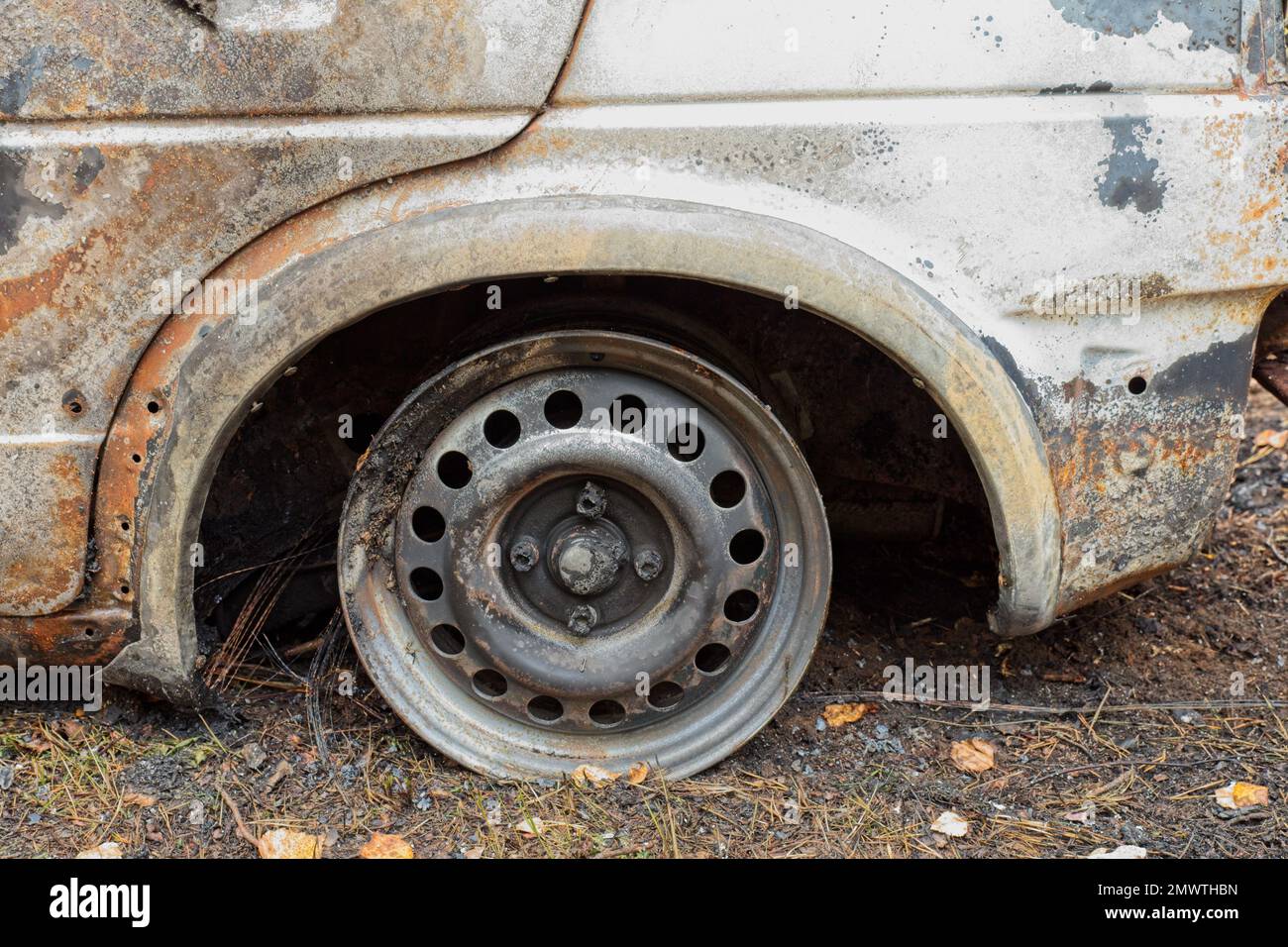 Wheel of a burned out car Stock Photo - Alamy