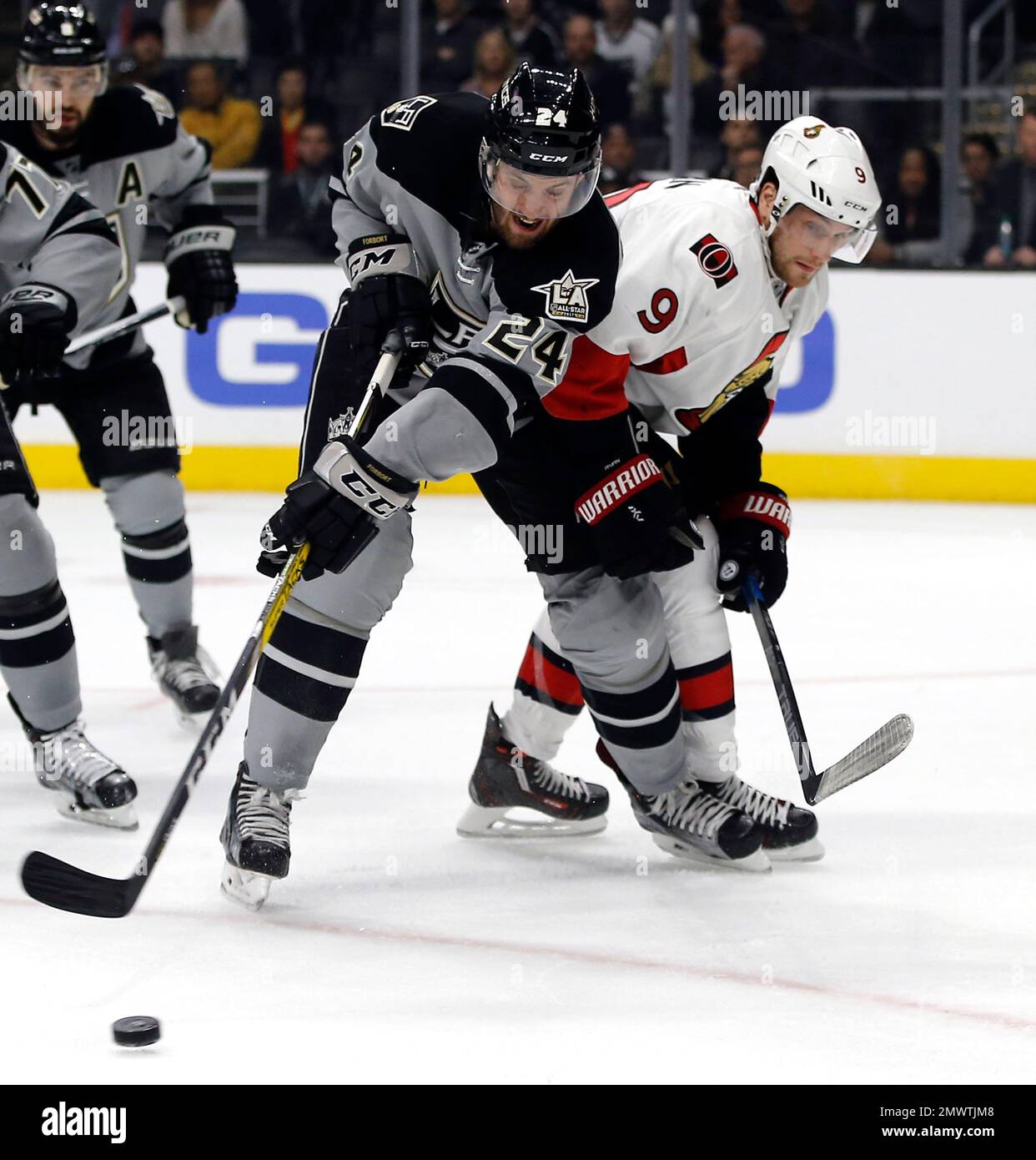 Los Angeles Kings defenseman Derek Forbort (24) passes the puck away ...