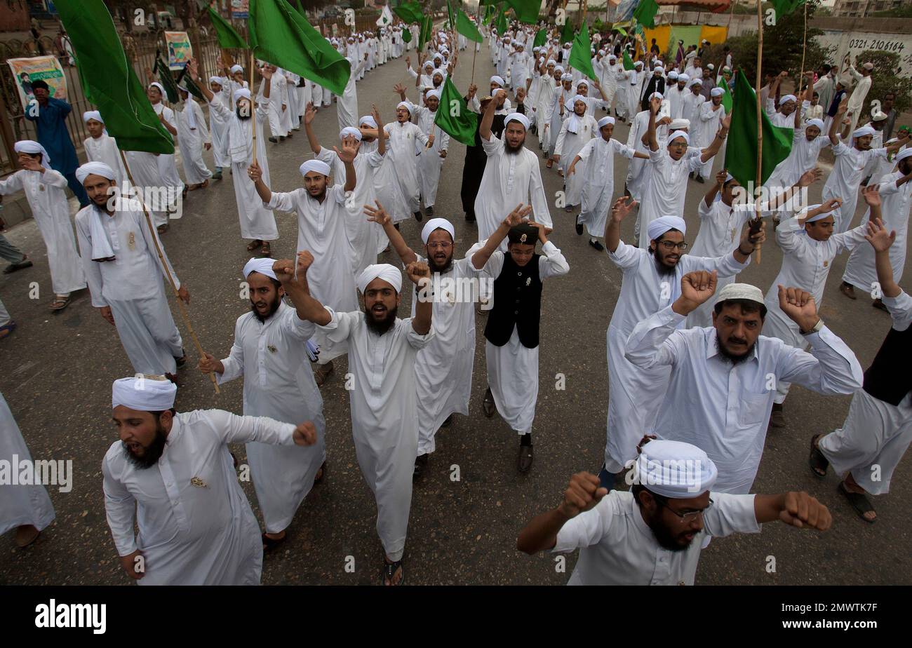 People chant religious slogans during a procession marking the birth ...