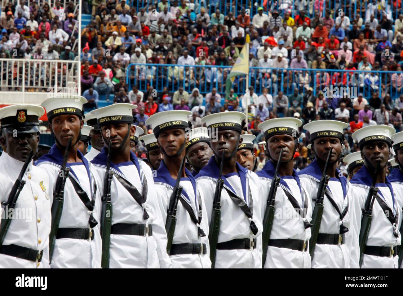 Kenyan Navy personnel take part in the trooping of the colour parade ...