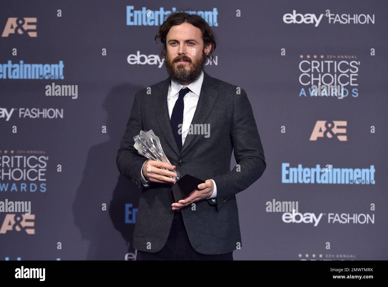 Casey Affleck poses in the press room with the award for best actor for ...