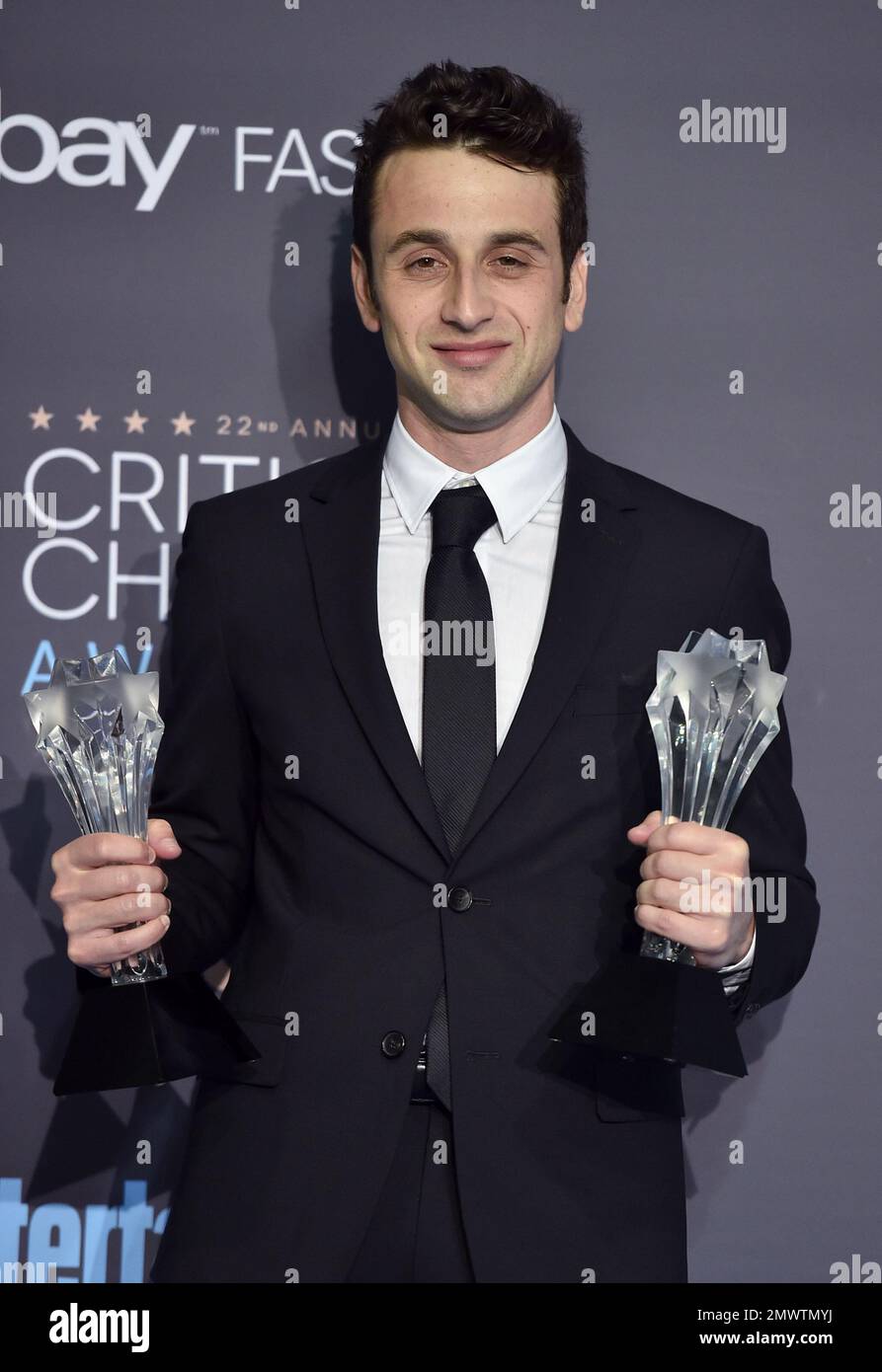 Justin Hurwitz poses in the press room with the awards for best song ...