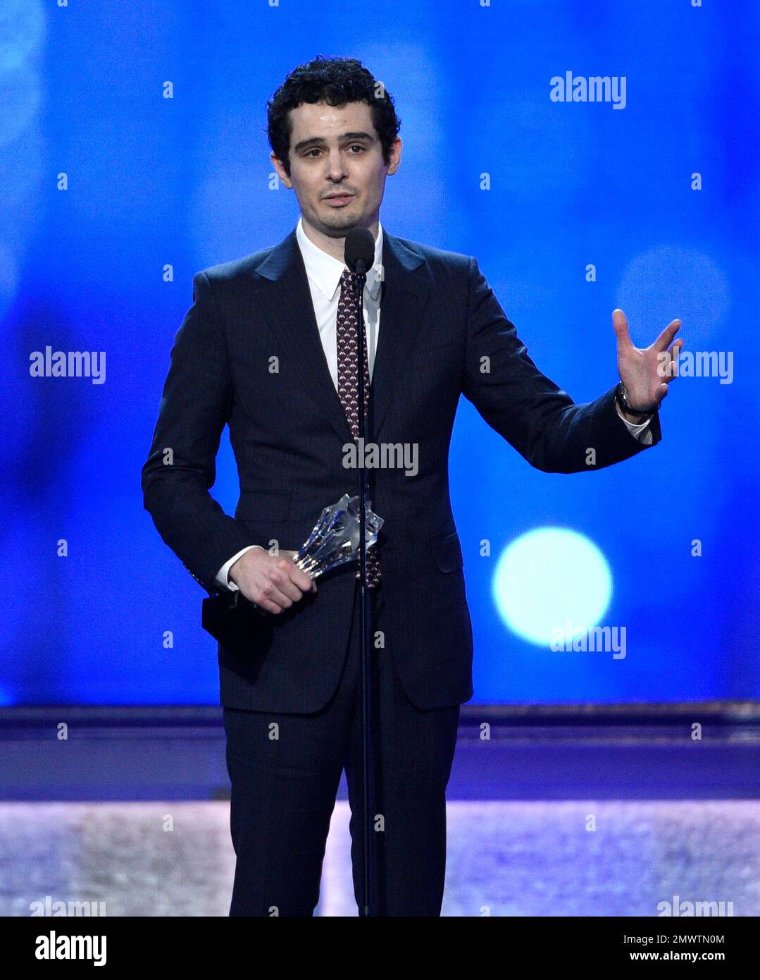 Damien Chazelle accepts the award for best director for "La La Land" at ...