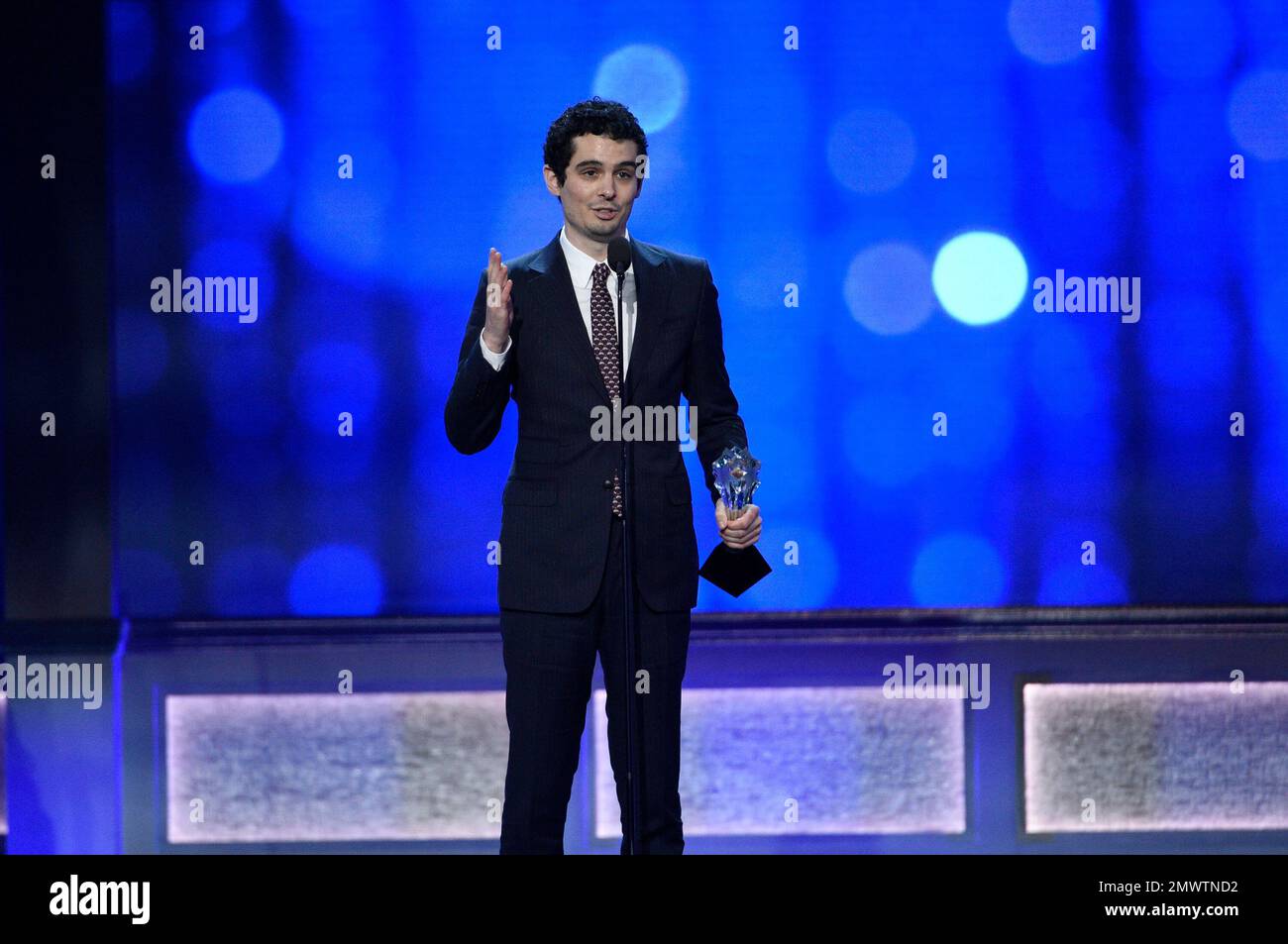 Damien Chazelle accepts the award for best director for "La La Land" at ...