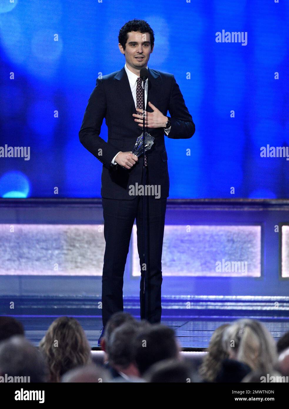 Damien Chazelle accepts the award for best director for "La La Land" at ...