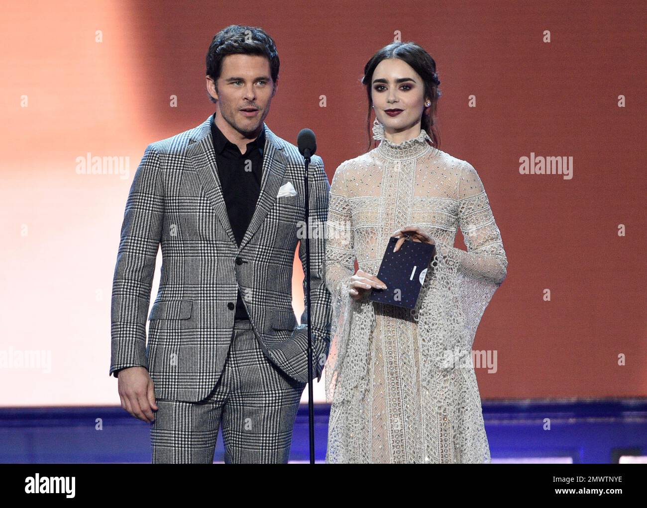 James Marsden, left, and Lily Collins present the award for best ...