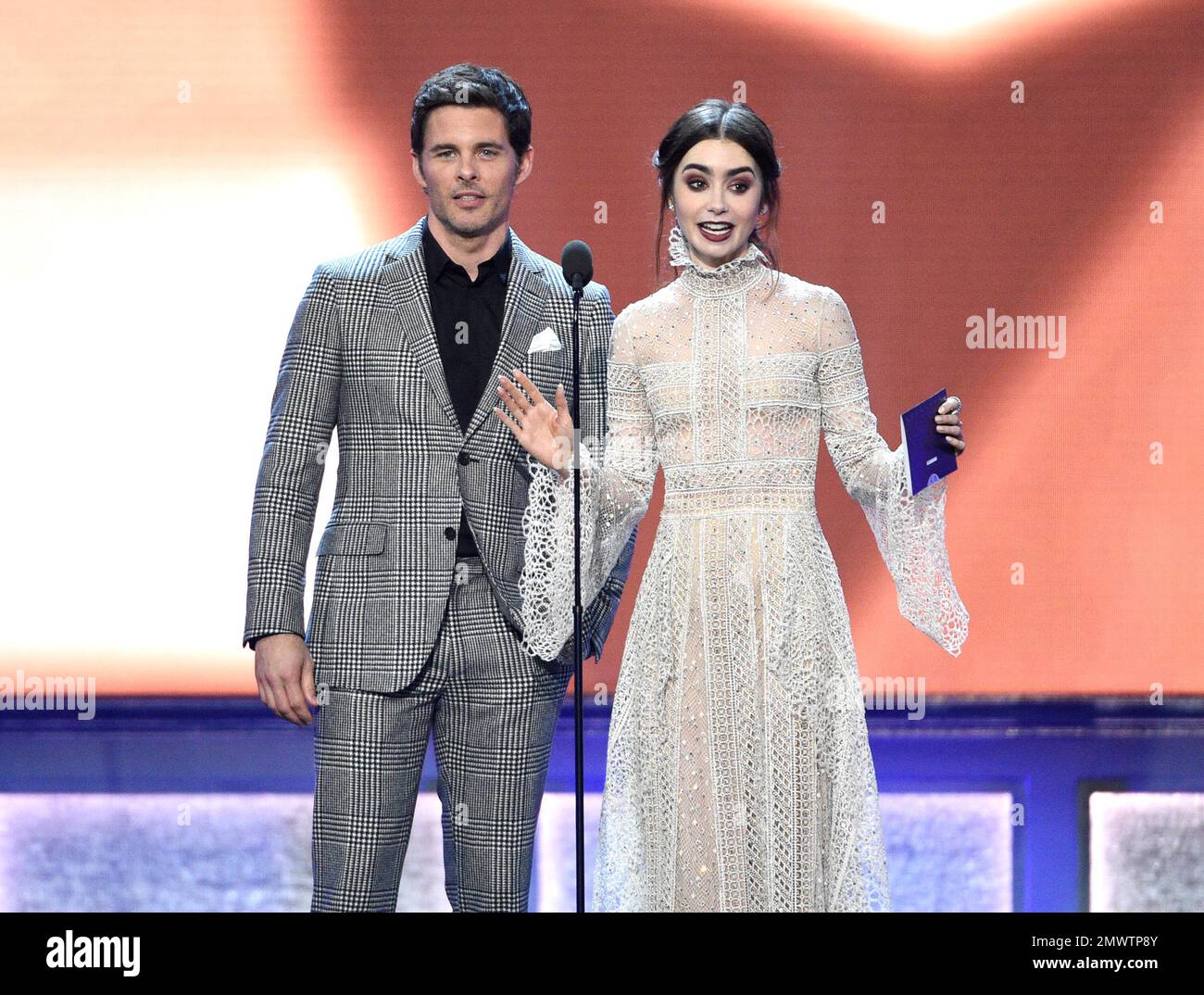 James Marsden, left, and Lily Collins present the award for best ...