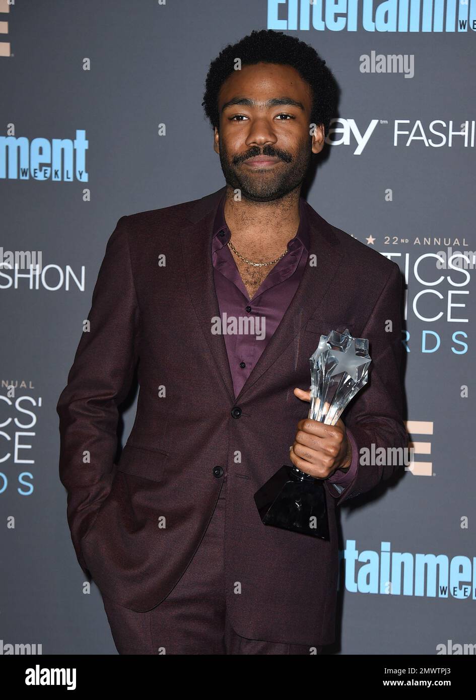 Donald Glover poses in the press room with the award for best actor in ...