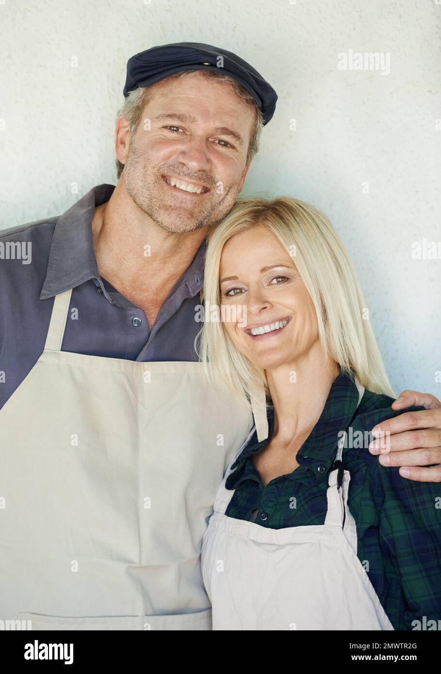 Happy to share the same interests. A farmer and his wife standing in ...