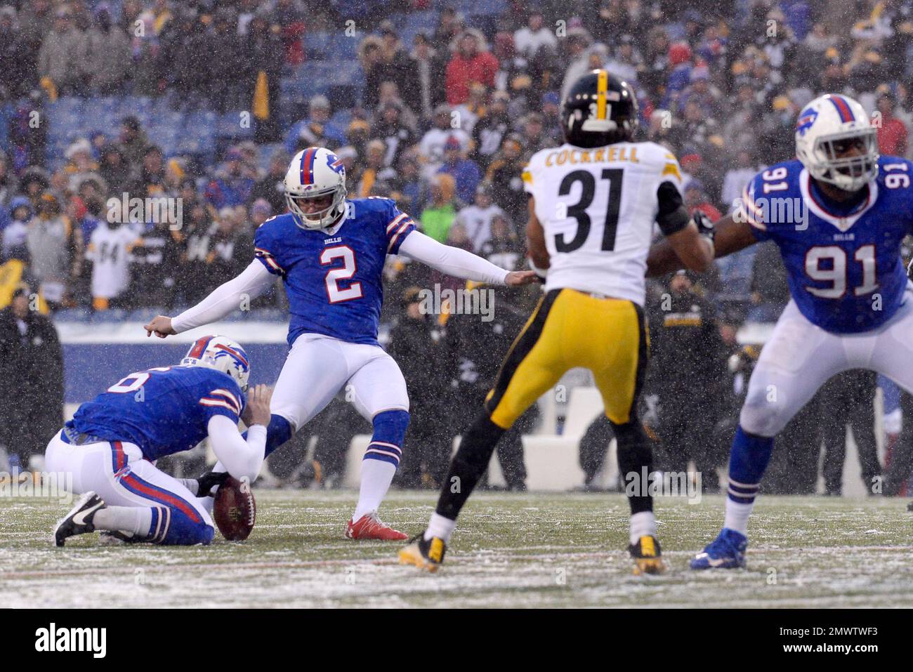 Buffalo Bills kicker Dan Carpenter (2), with Colton Schmidt (6) holding ...