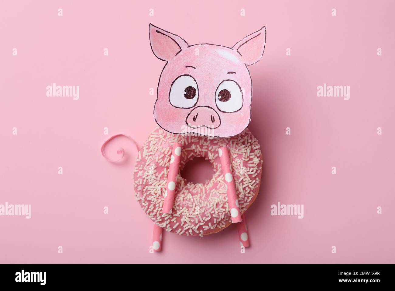 Funny pig made with donut and piece of paper on pink background, top ...