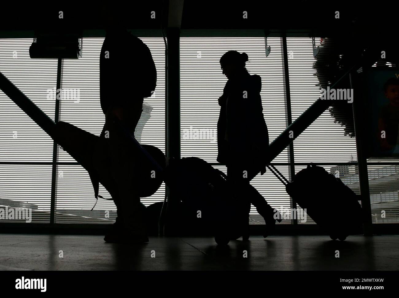 Passengers walk through Terminal 3 at O'Hare International Airport on ...