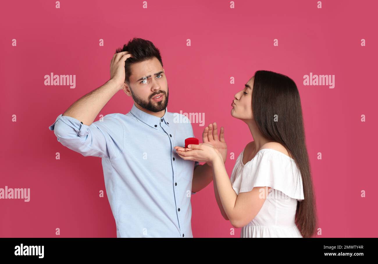 Young woman with engagement ring making marriage proposal to her ...