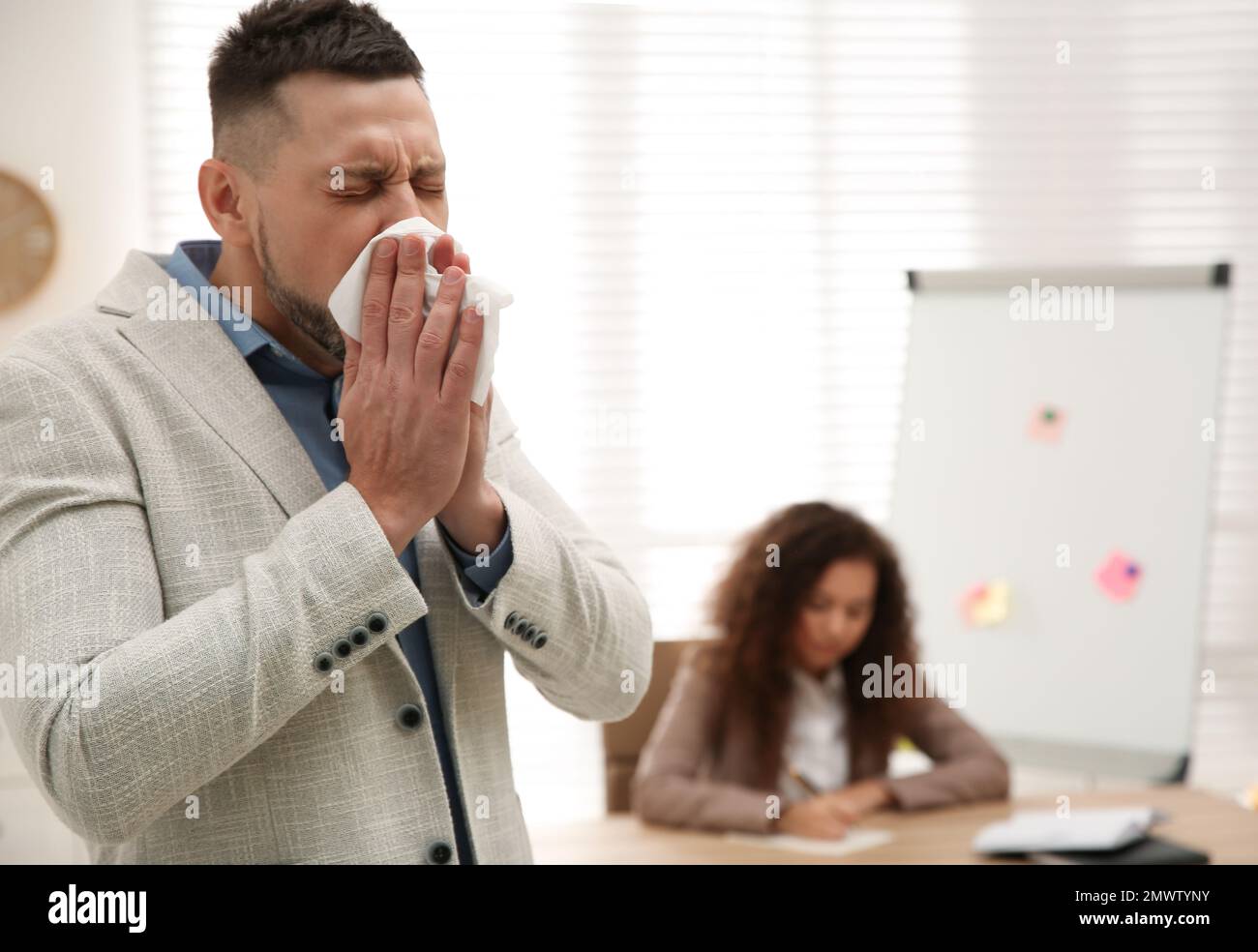 Office worker sneezing hi-res stock photography and images - Alamy