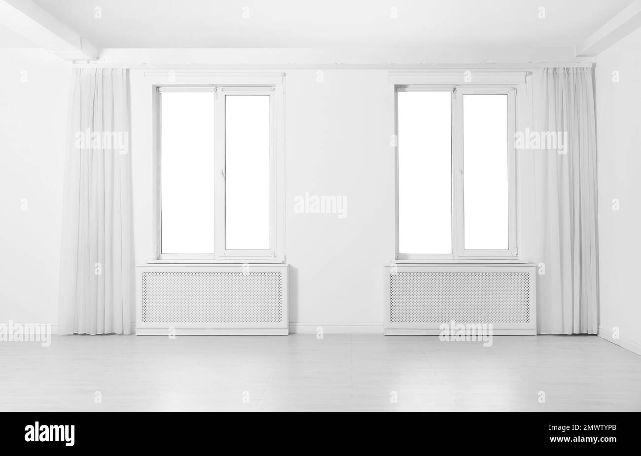 Windows with elegant curtains in empty room Stock Photo - Alamy