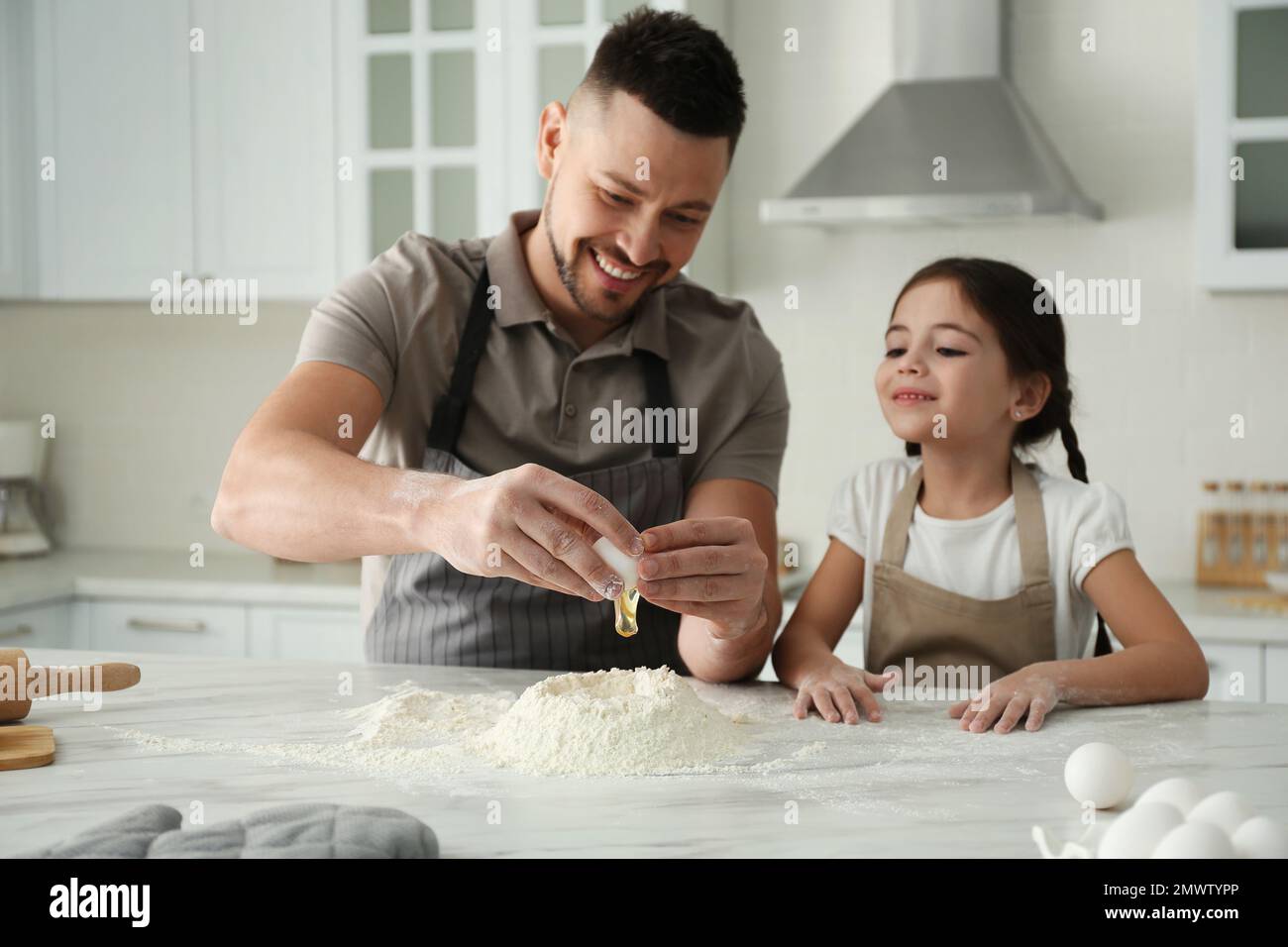 Father and daughter cooking together in kitchen Stock Photo - Alamy