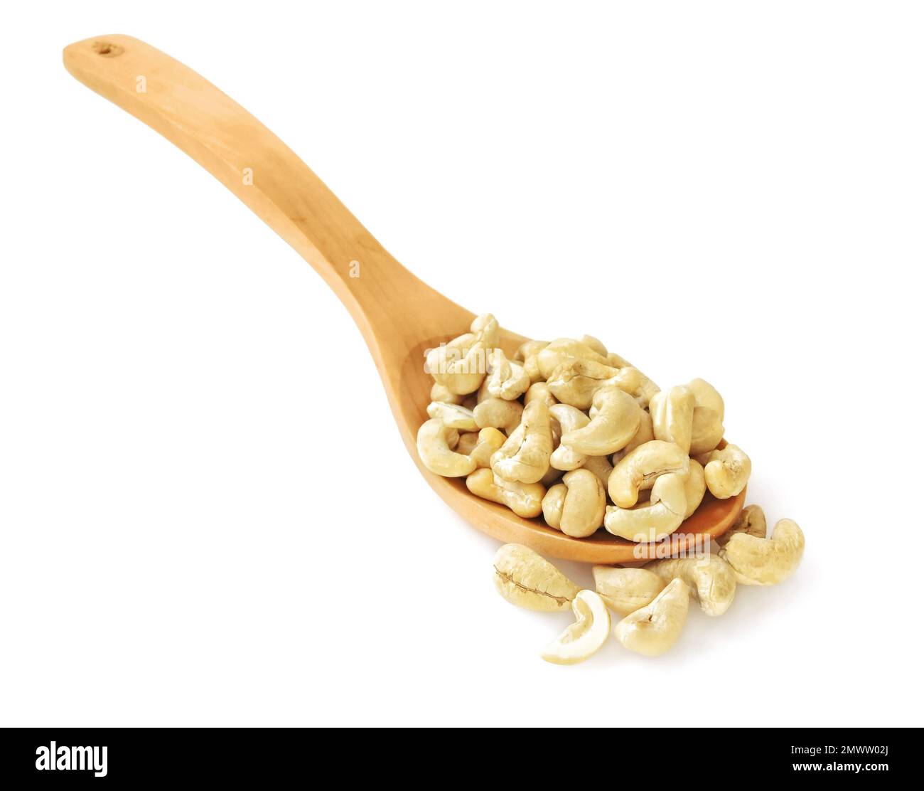 Cashew nuts in a wooden spoon on white background Stock Photo - Alamy
