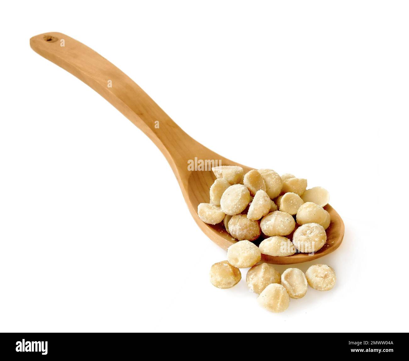 :acadamia nuts in wooden spoon on white background Stock Photo - Alamy