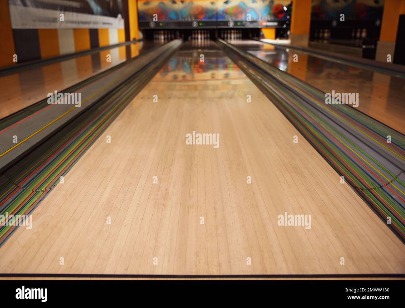 Empty wooden alley lane in modern bowling club Stock Photo - Alamy
