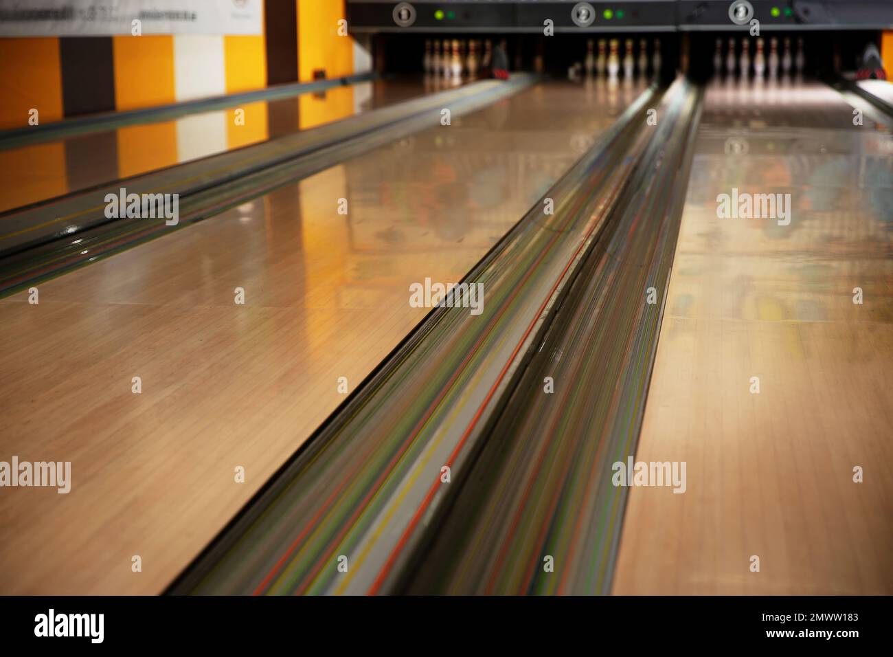 Empty wooden alley lane in modern bowling club Stock Photo - Alamy