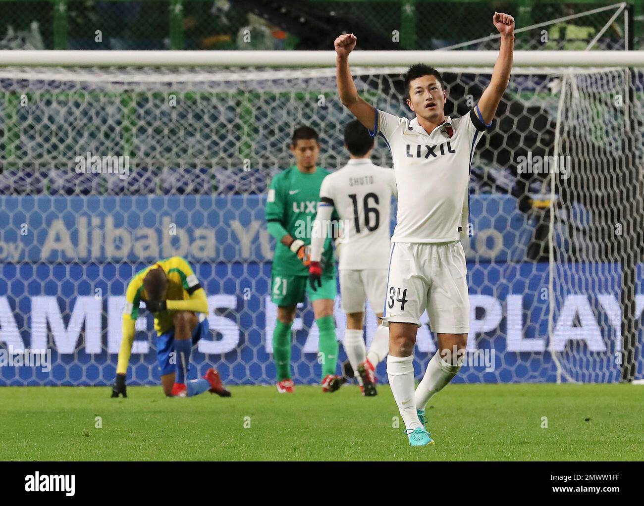 Kashima Antlers' Yuma Suzuki, right, celebrates his team's victory ...