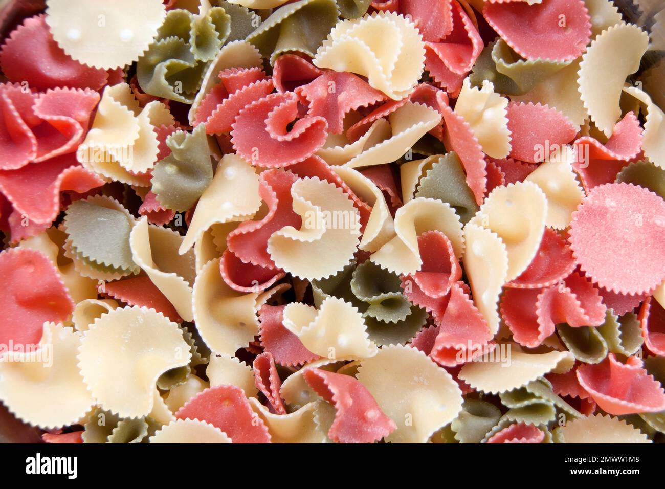Colorful pasta sorts with egg, tomato and spinach Stock Photo - Alamy