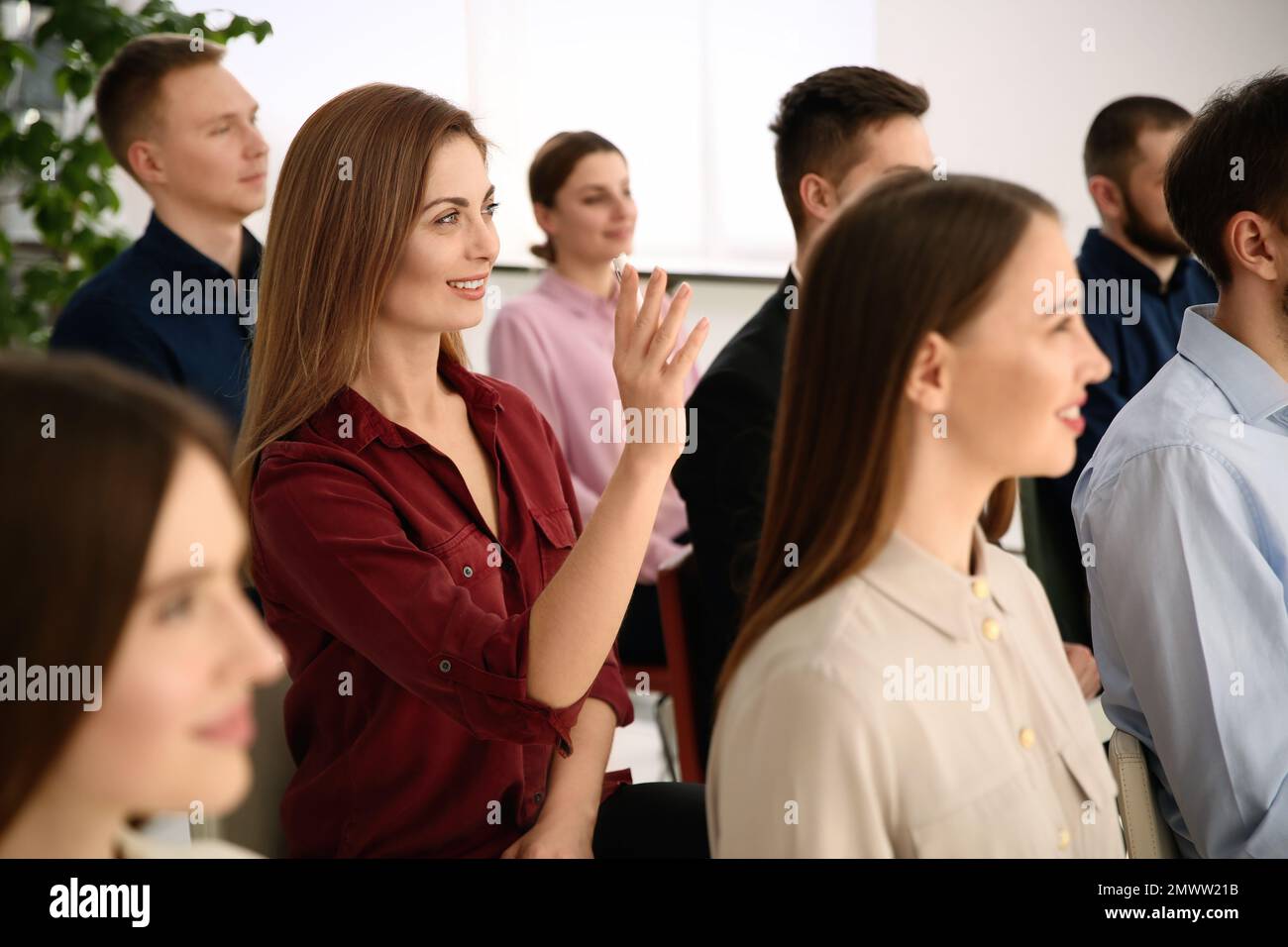 Woman raising hand question hi-res stock photography and images - Alamy