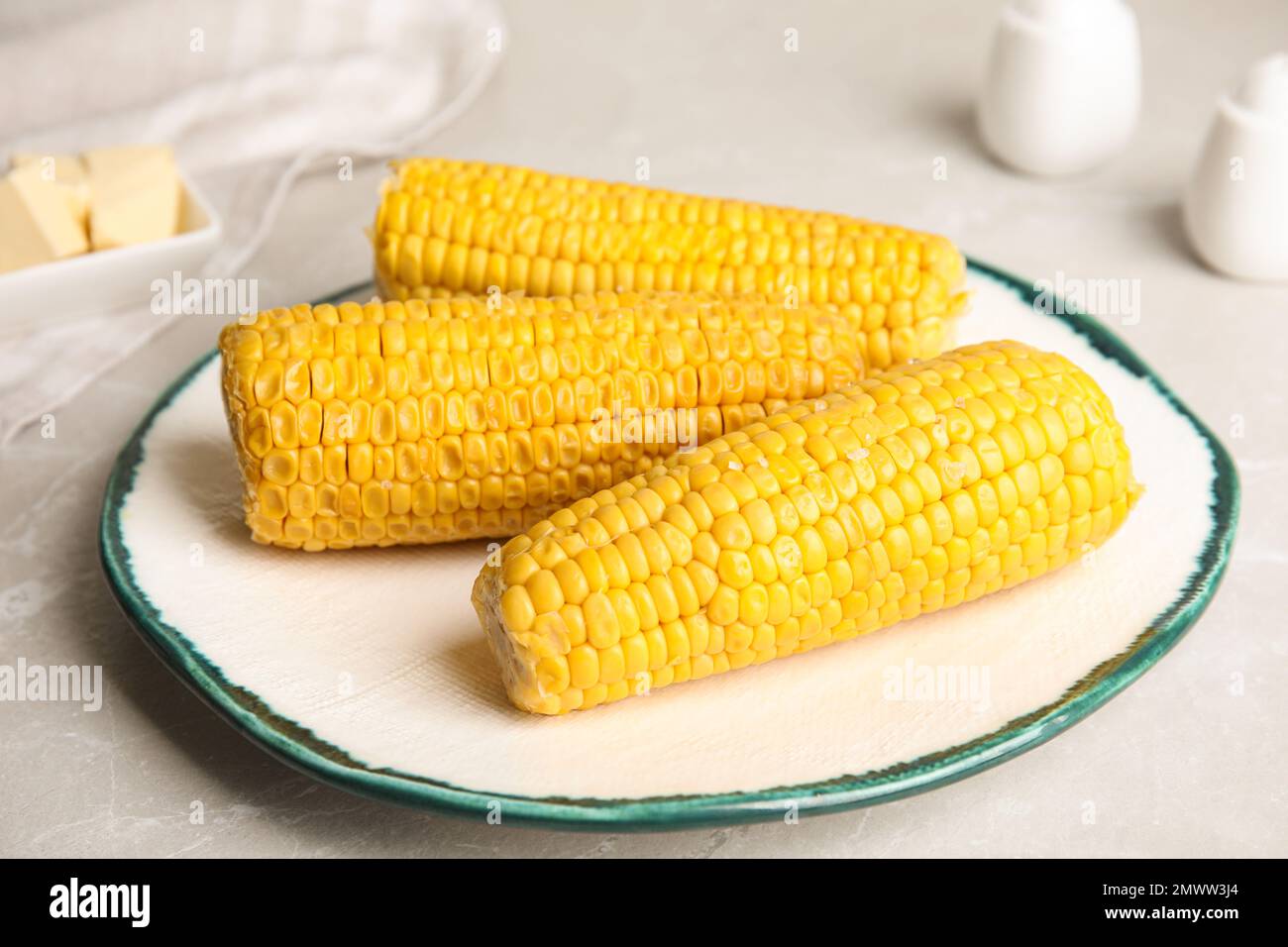 Delicious boiled corn on light grey marble table Stock Photo - Alamy