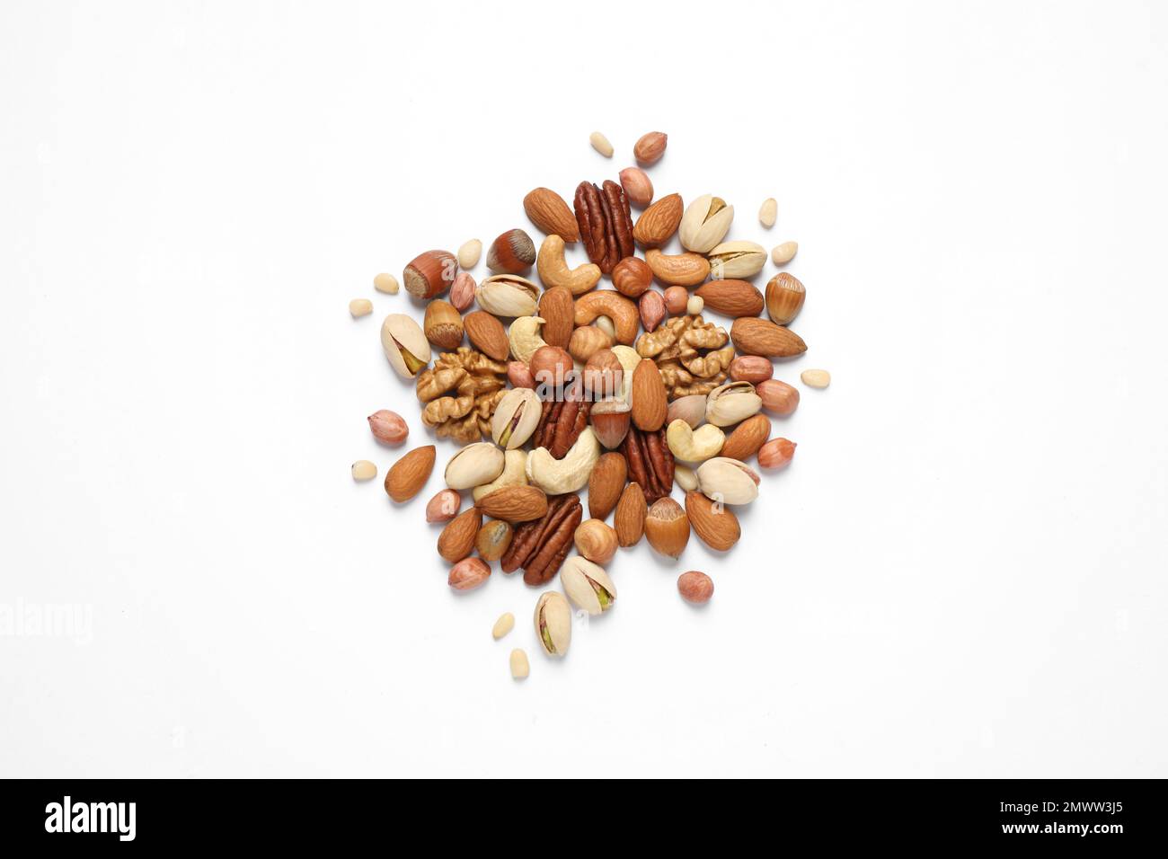 Different delicious nuts on white background, flat lay Stock Photo - Alamy