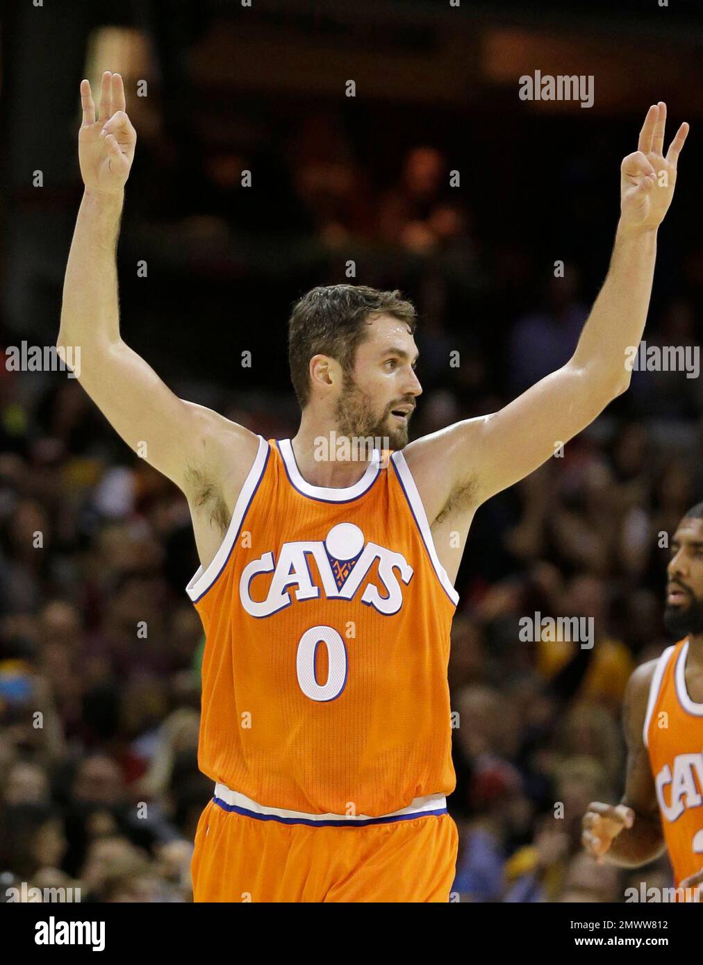 Cleveland Cavaliers' Kevin Love reacts after scoring a three-point shot ...