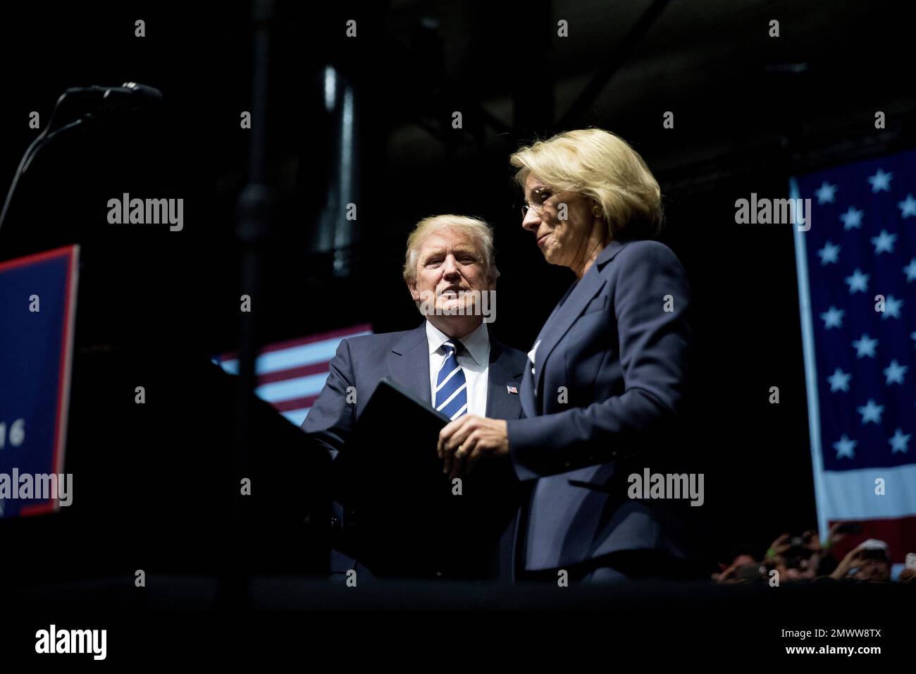 President-elect Donald Trump, center, welcomes his pick for Education ...