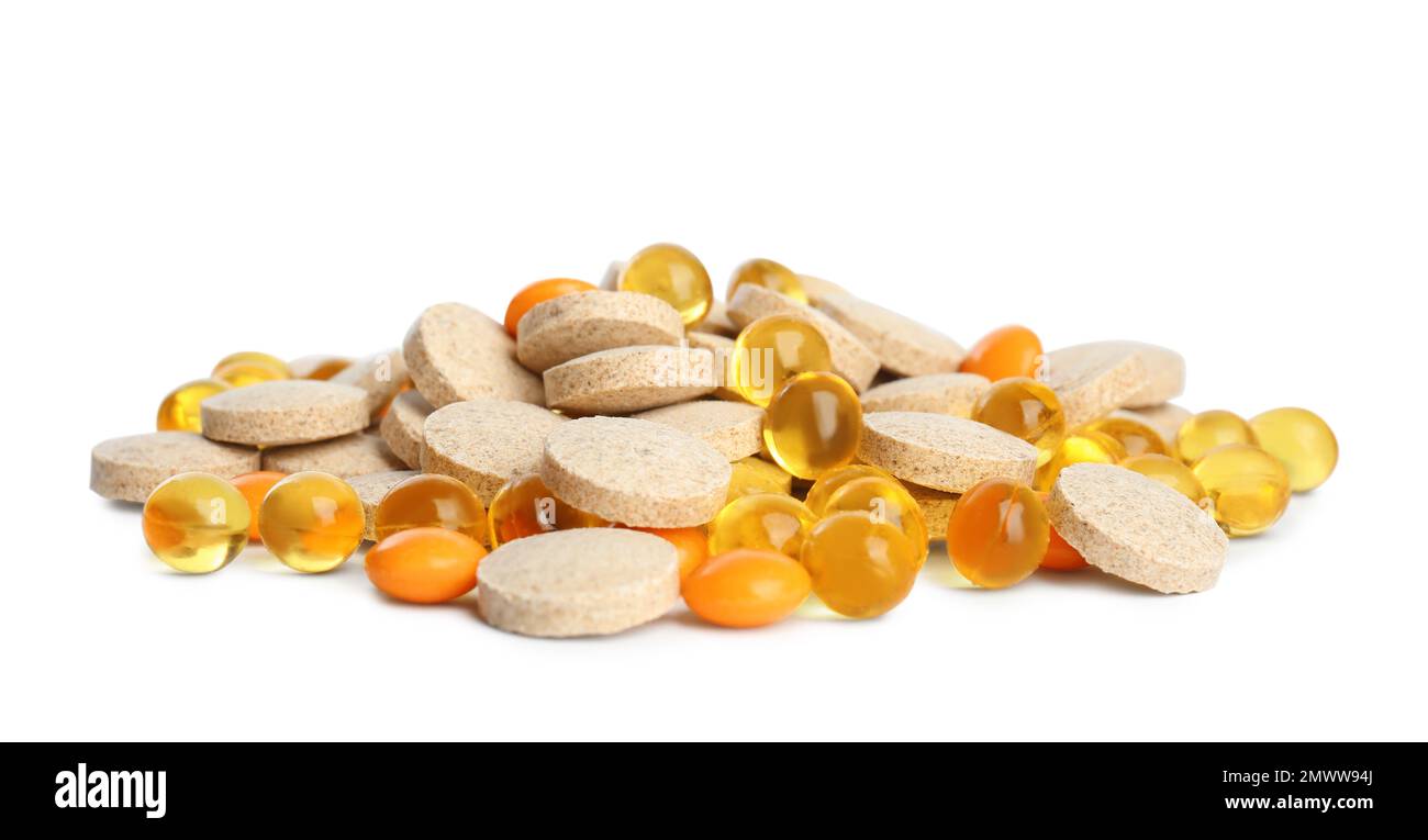 Pile of different vitamin pills isolated on white Stock Photo - Alamy